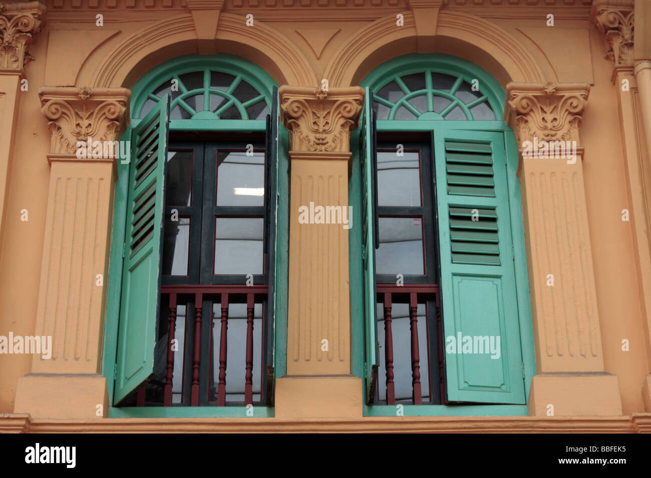 First floor window with shutters in Chinatown Singapore Stock Photo - Alamy