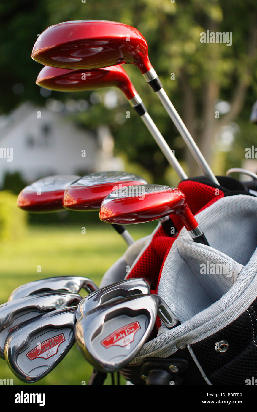 Set of red Golf clubs in a red bag for a woman low angle from below ...
