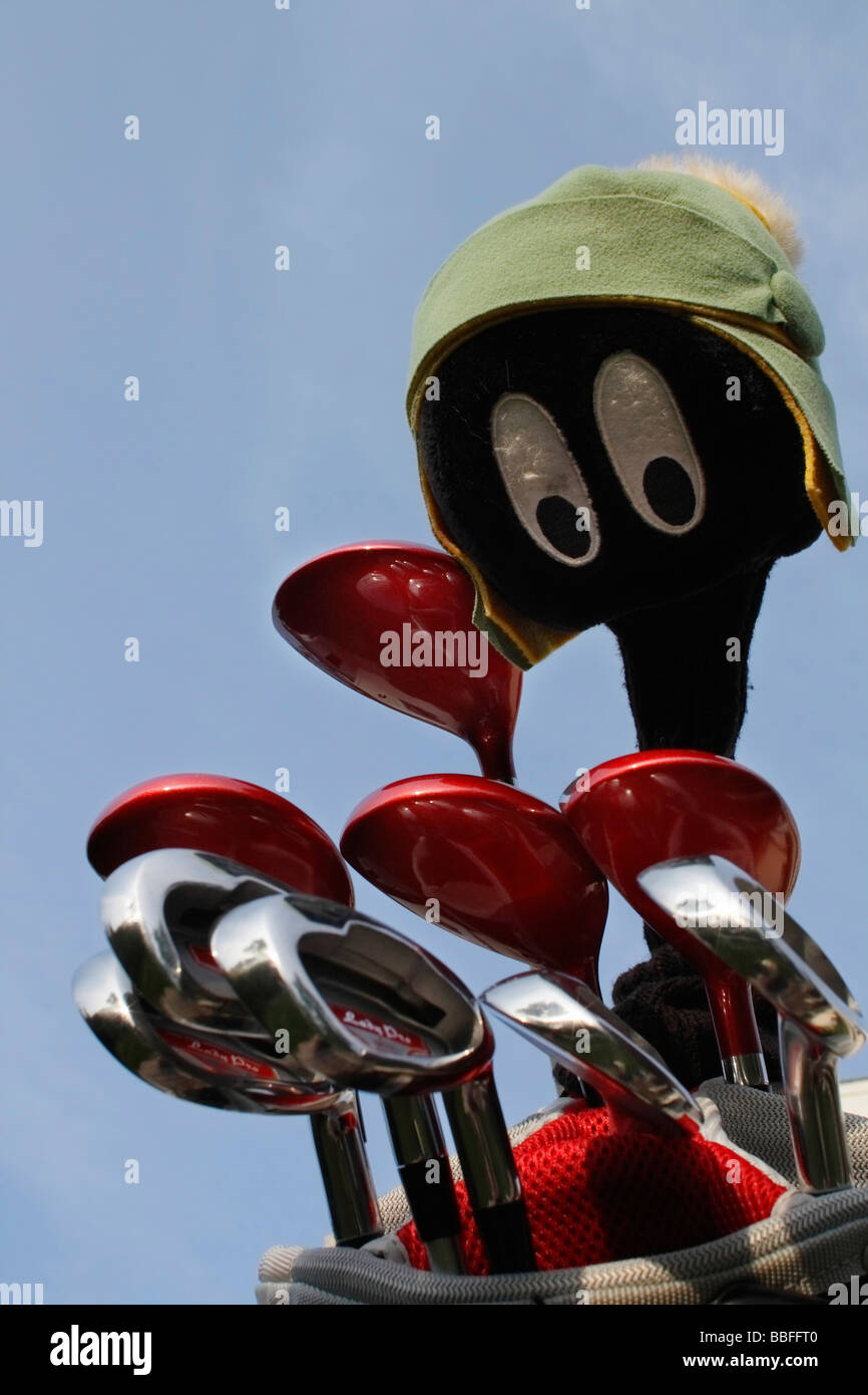 Ladies golf bag with a full set of red golf clubs in the golf bag ...