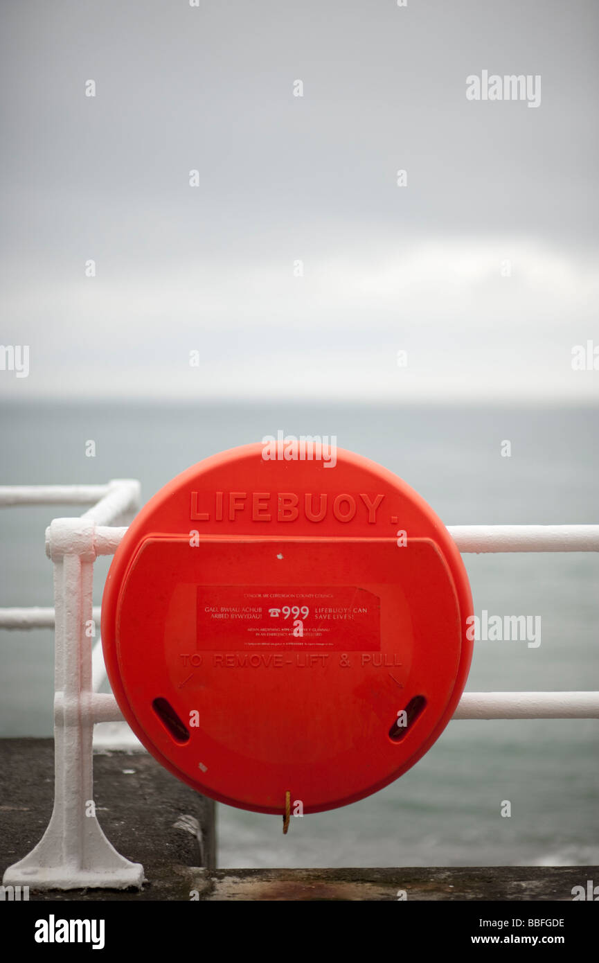 Orange lifebuoy on seaside promenade railings, UK Stock Photo - Alamy