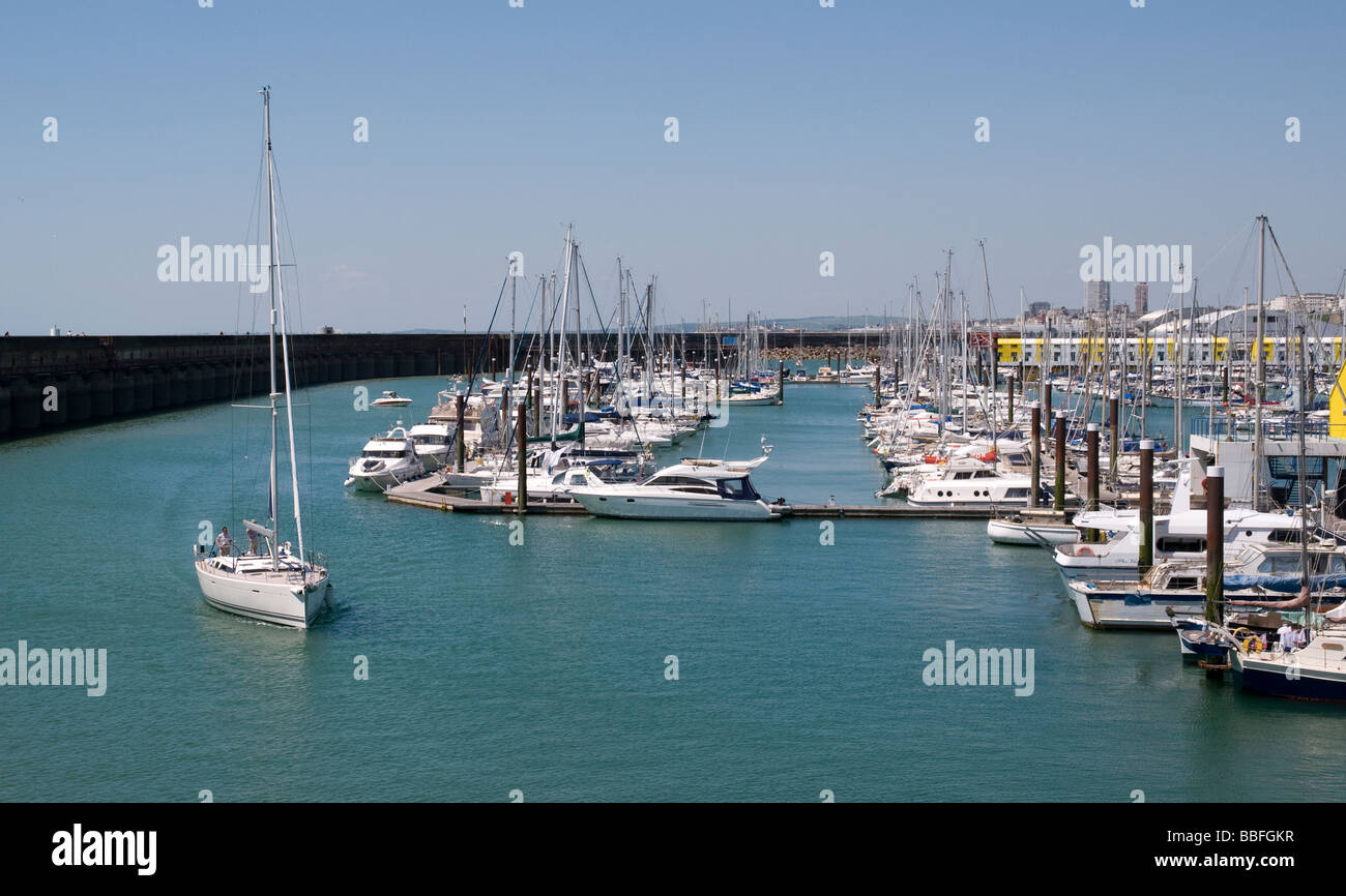 A yacht sailing within Brighton Marina, England Stock Photo - Alamy