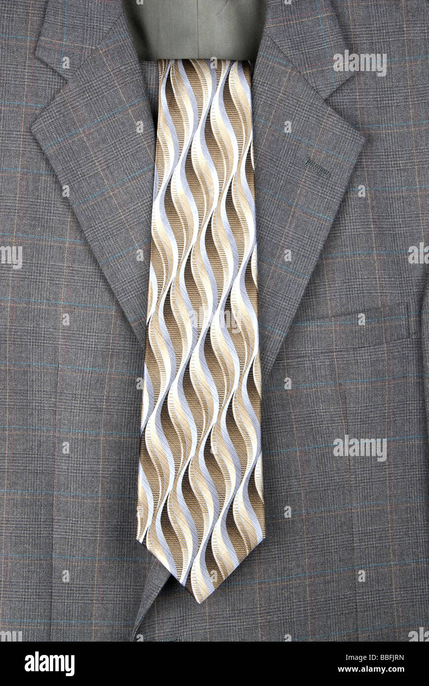 A business suit and necktie hang from a hanger Stock Photo - Alamy