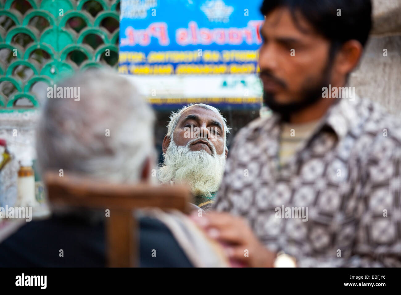 Barber Trimming a Muslim Man s Beard in Delhi India Stock Photo - Alamy