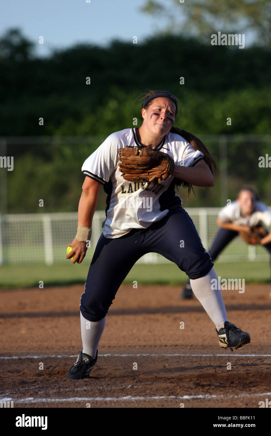 A High School pitcher winds up during a softball game in Stratford ...
