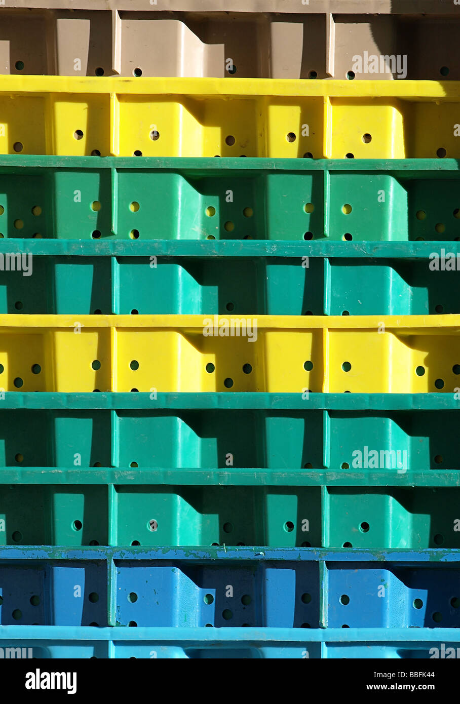 Stock photo of colorful stacked plastic crates in portrait format Stock ...