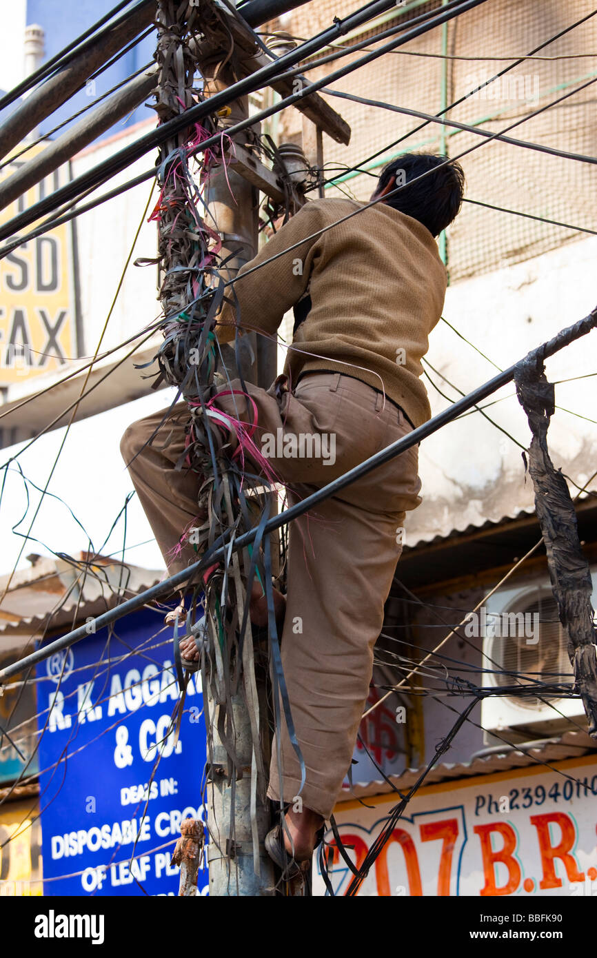 Man in a Tangle of Wires and Cables in Old Delhi India Stock Photo - Alamy