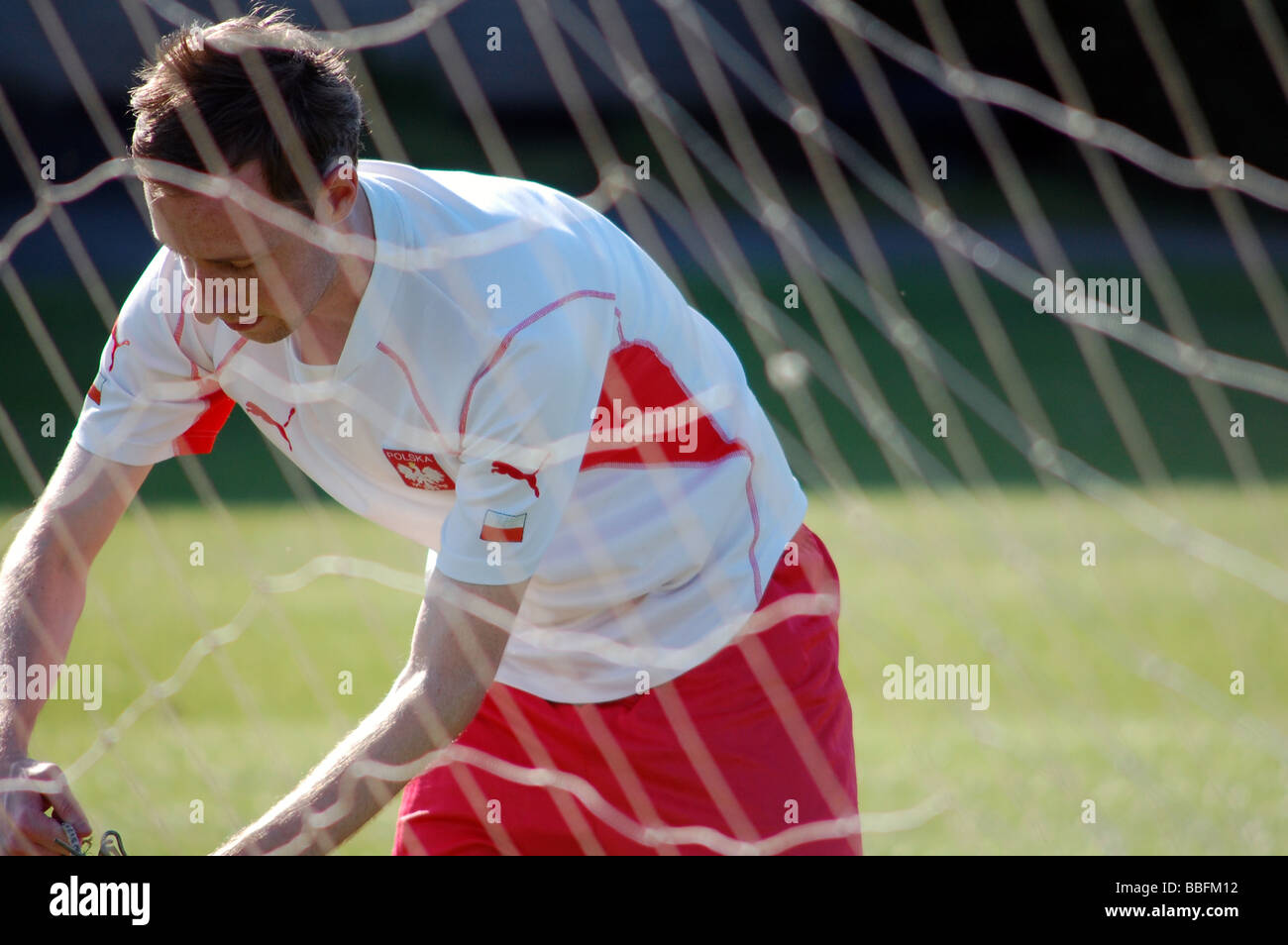 Footballer behind net hi-res stock photography and images - Alamy