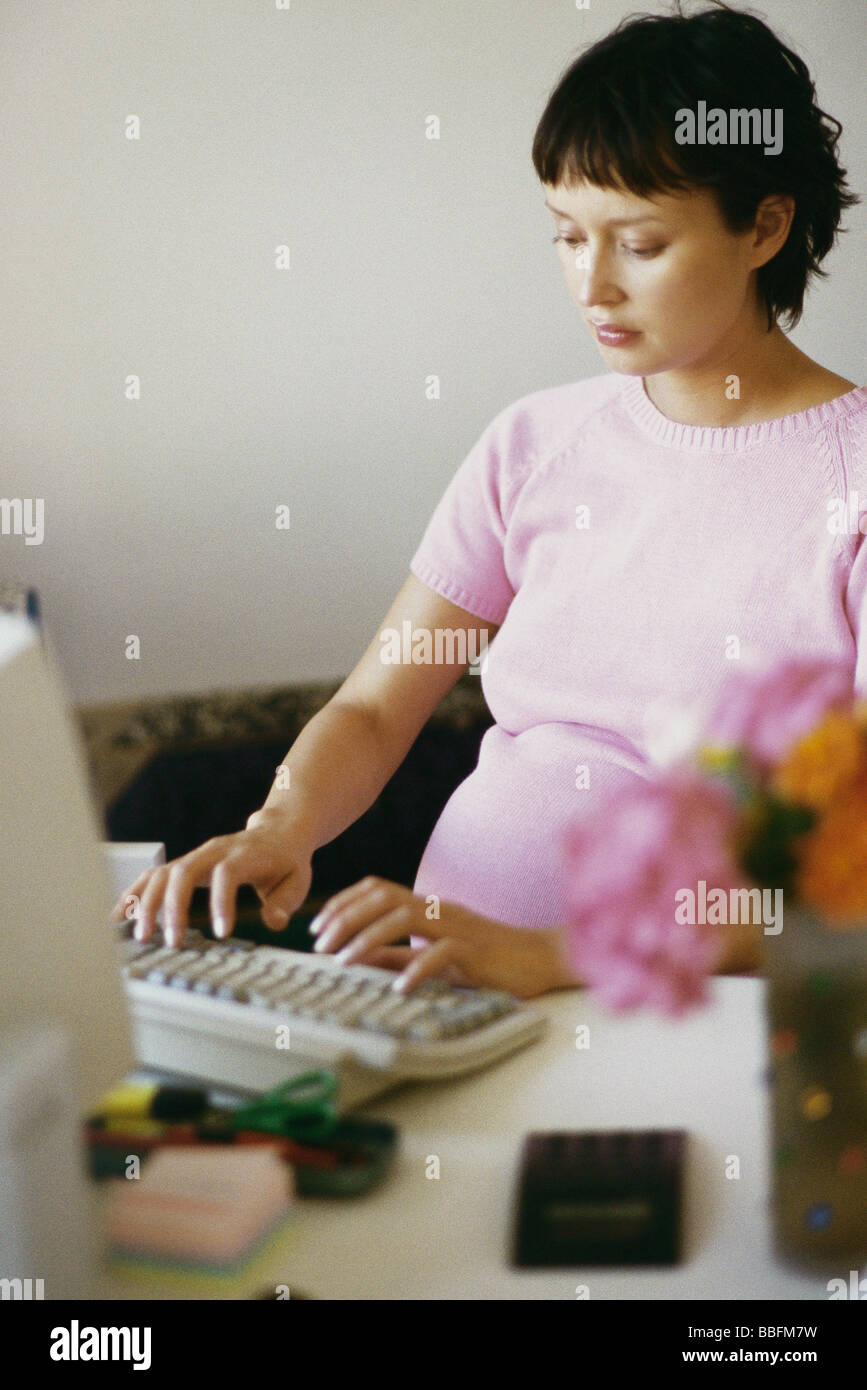 Woman typing on keyboard Stock Photo - Alamy