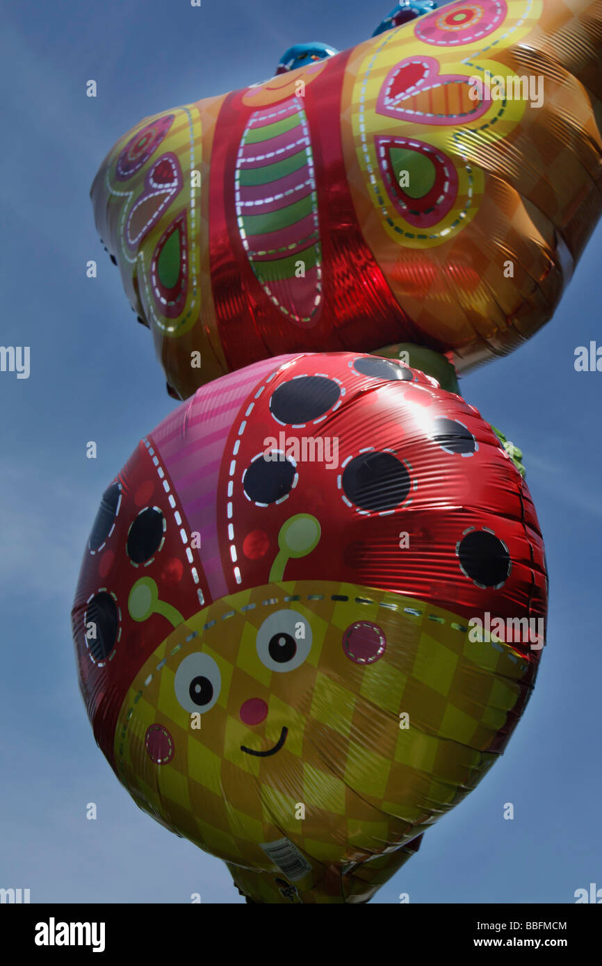 Happy Birthday balloons float against blue sky background close up from ...