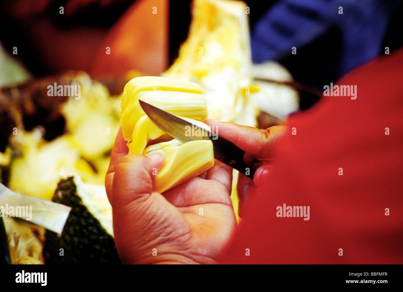 Close up of market vendor preparing jackfruit Stock Photo - Alamy