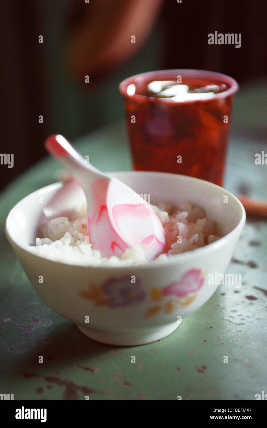 Bowl of white rice with spoon Stock Photo - Alamy