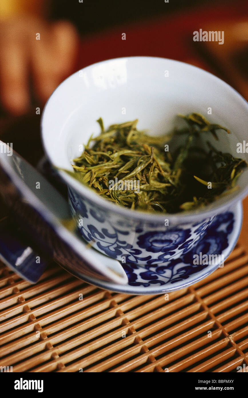 Tea leaves in bottom of empty tea cup Stock Photo - Alamy