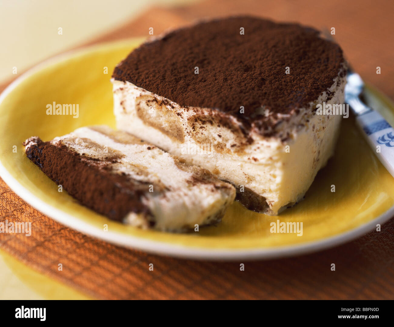 Slice of tiramisu on plate Stock Photo - Alamy