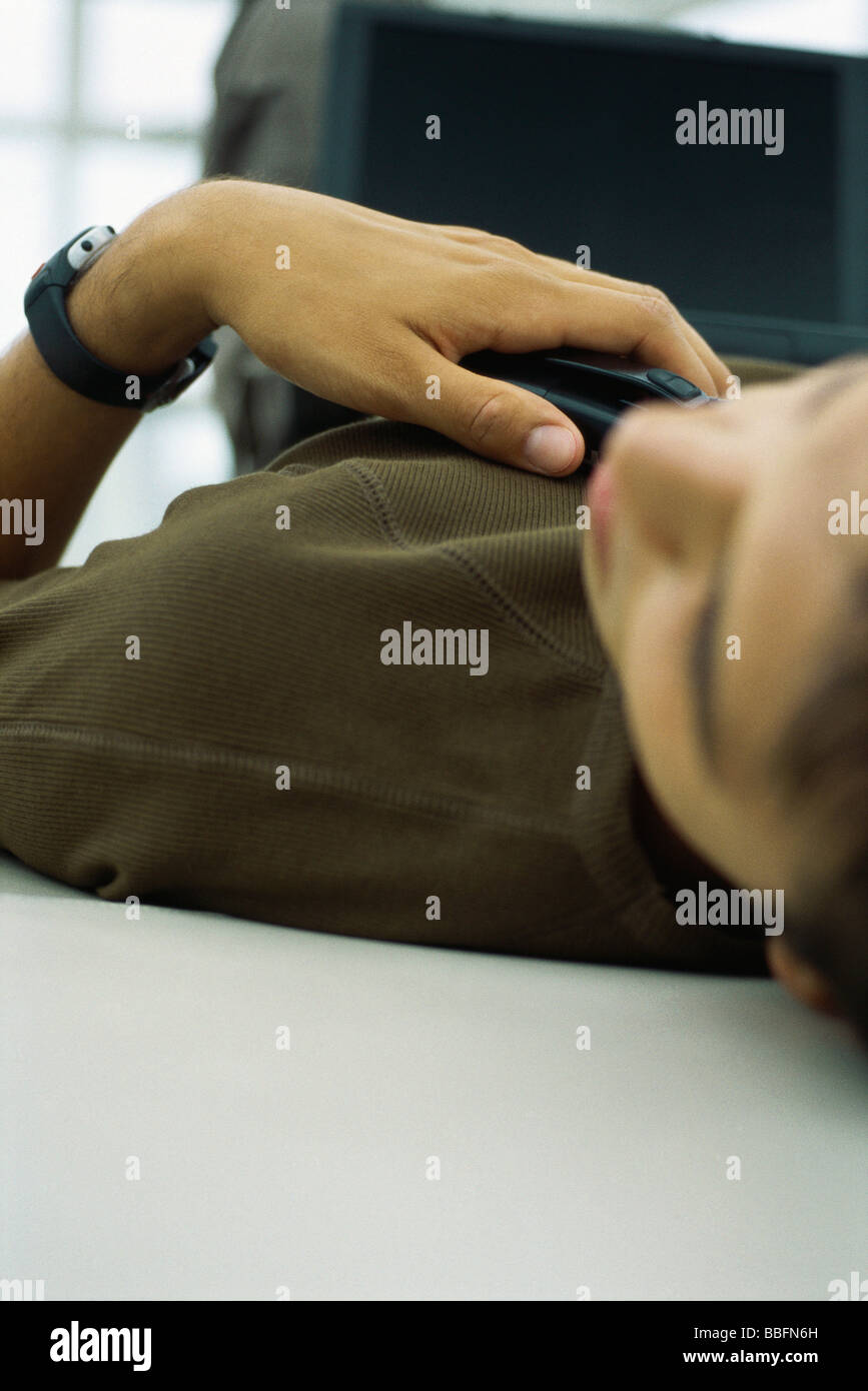 Man napping with laptop computer on lap, close-up, cropped view Stock ...