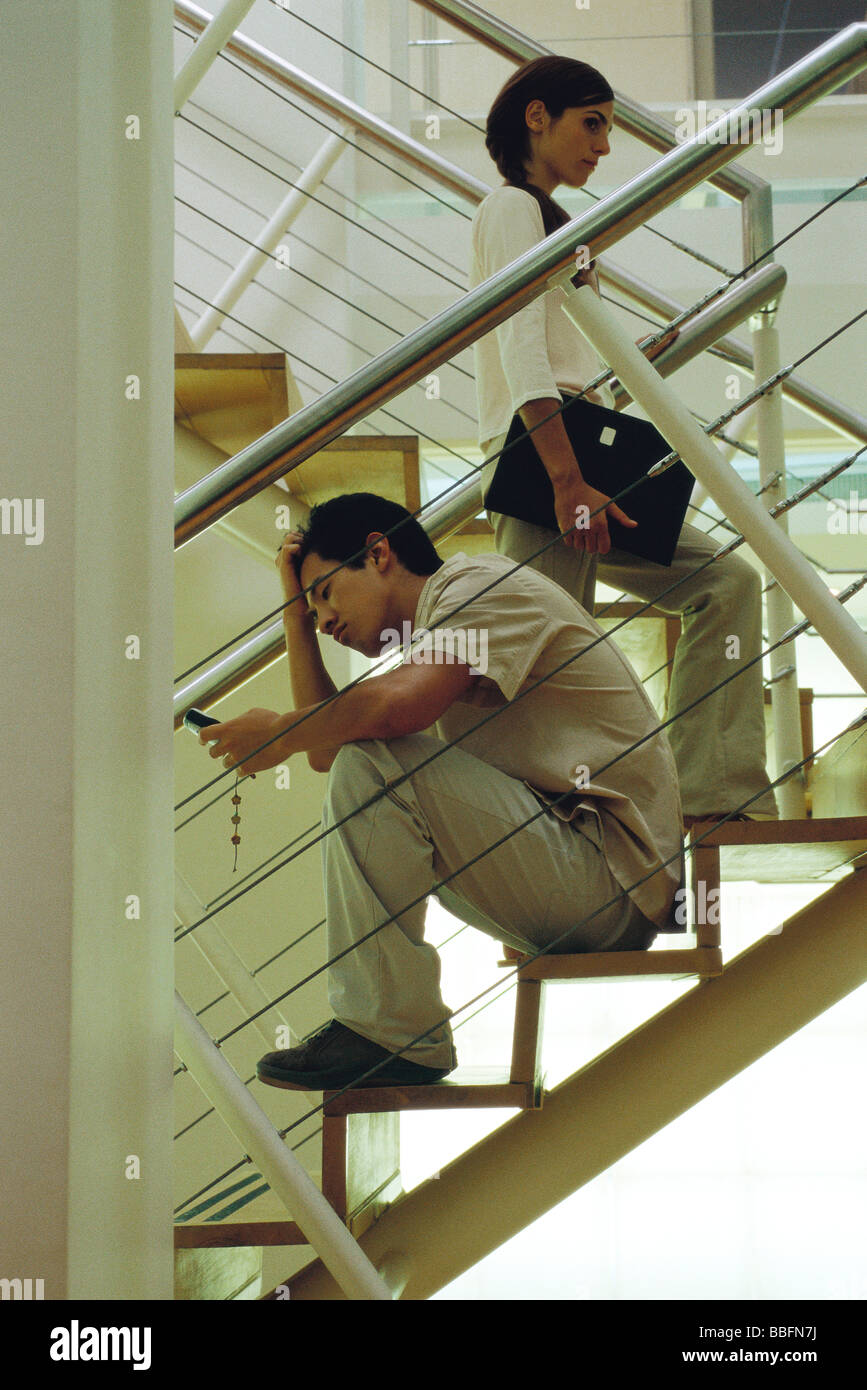 Man and woman going up steps hi-res stock photography and images - Alamy