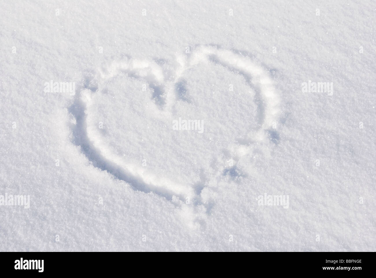 Heart drawn on snowy ice hi-res stock photography and images - Alamy