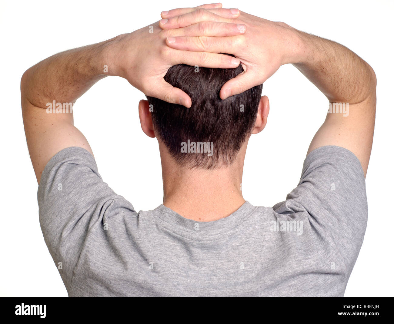 Man with hands on the top of his head Stock Photo - Alamy