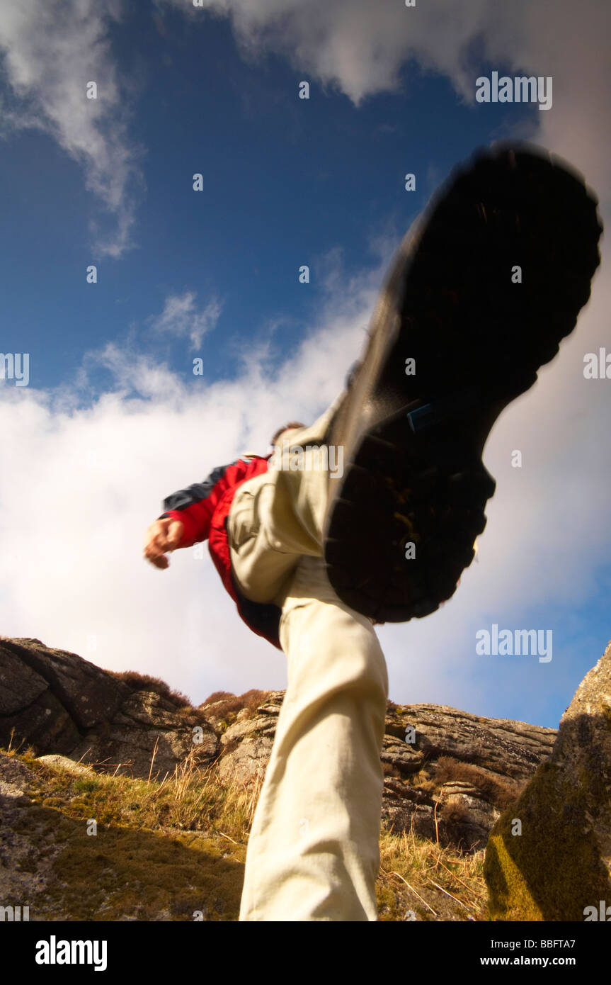 Walkers big foot stepping on the camera Stock Photo - Alamy