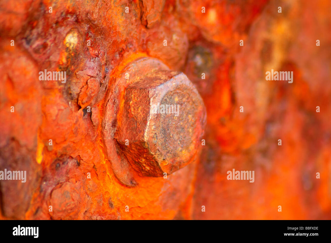 Rusty red bolt Stock Photo - Alamy