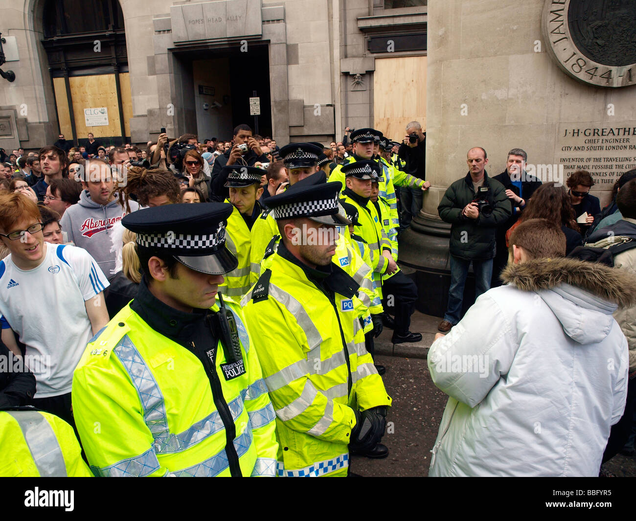 Demonstrators cordoned off by Territorial Support Group police officers ...