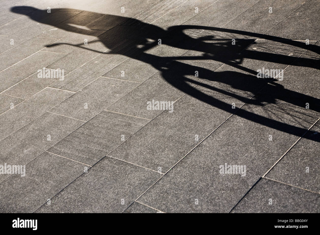 Shadow of a person riding a bike Stock Photo - Alamy
