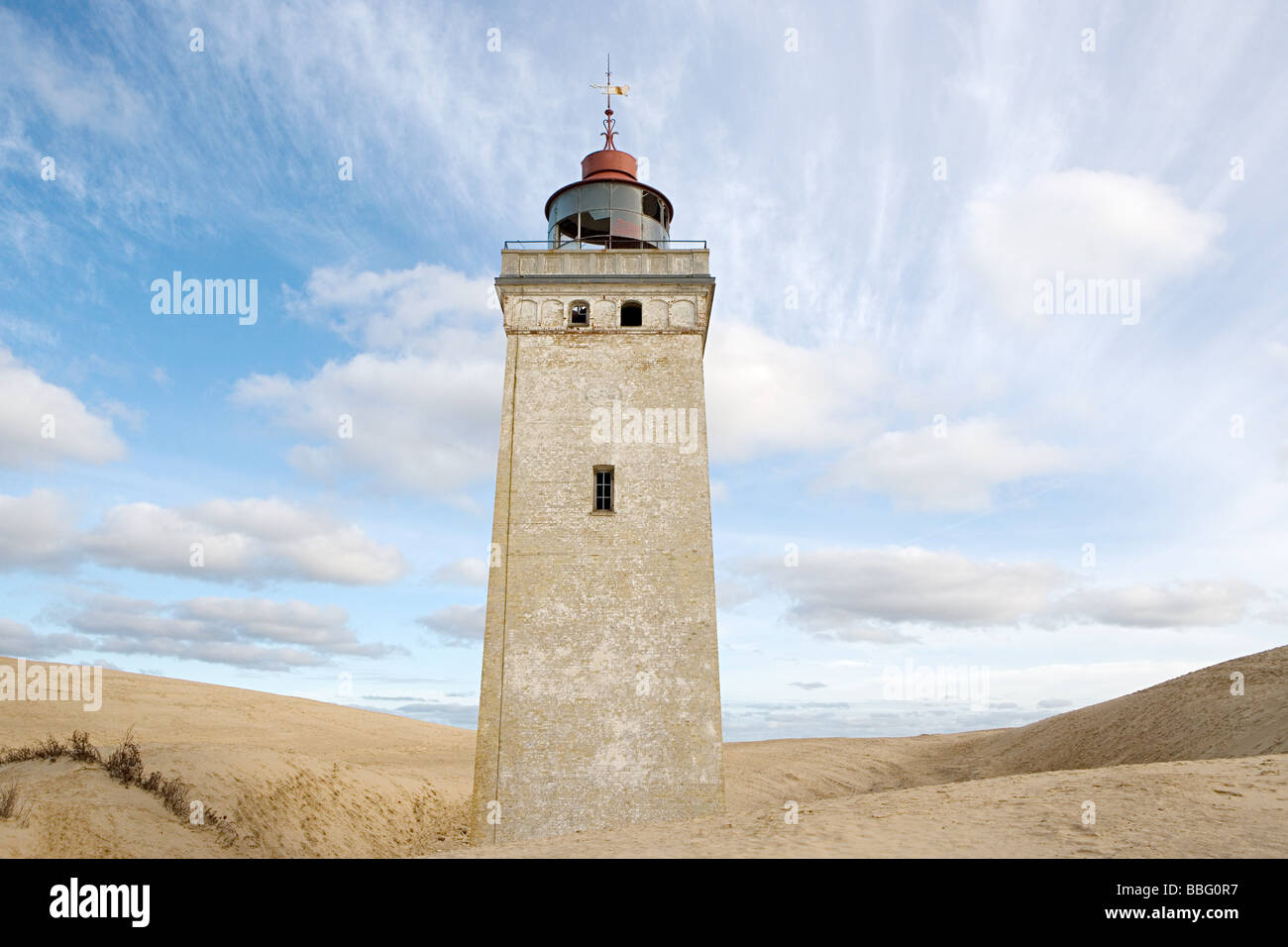 A lighthouse on a beach Stock Photo - Alamy