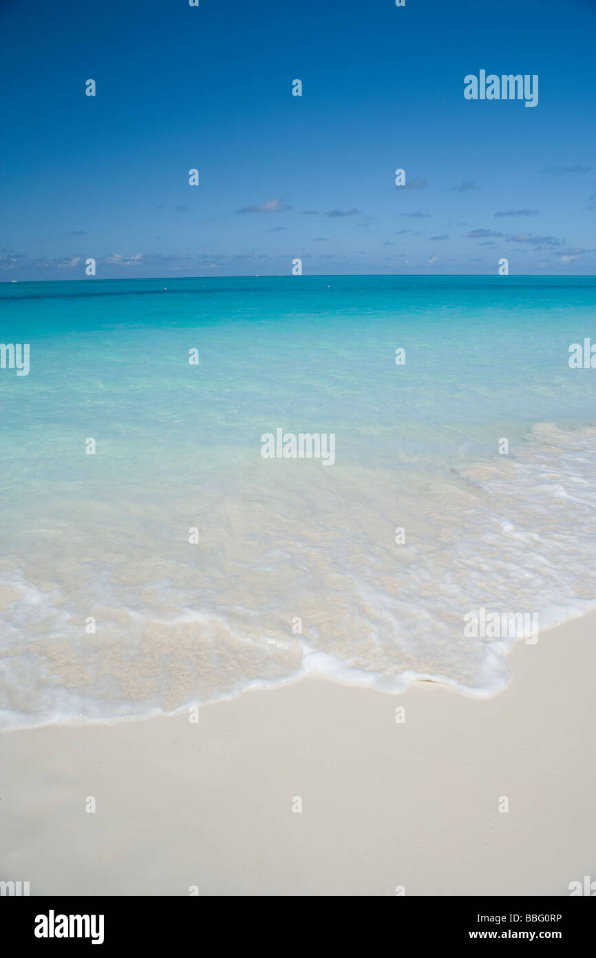 Waves on sandy beach Stock Photo - Alamy