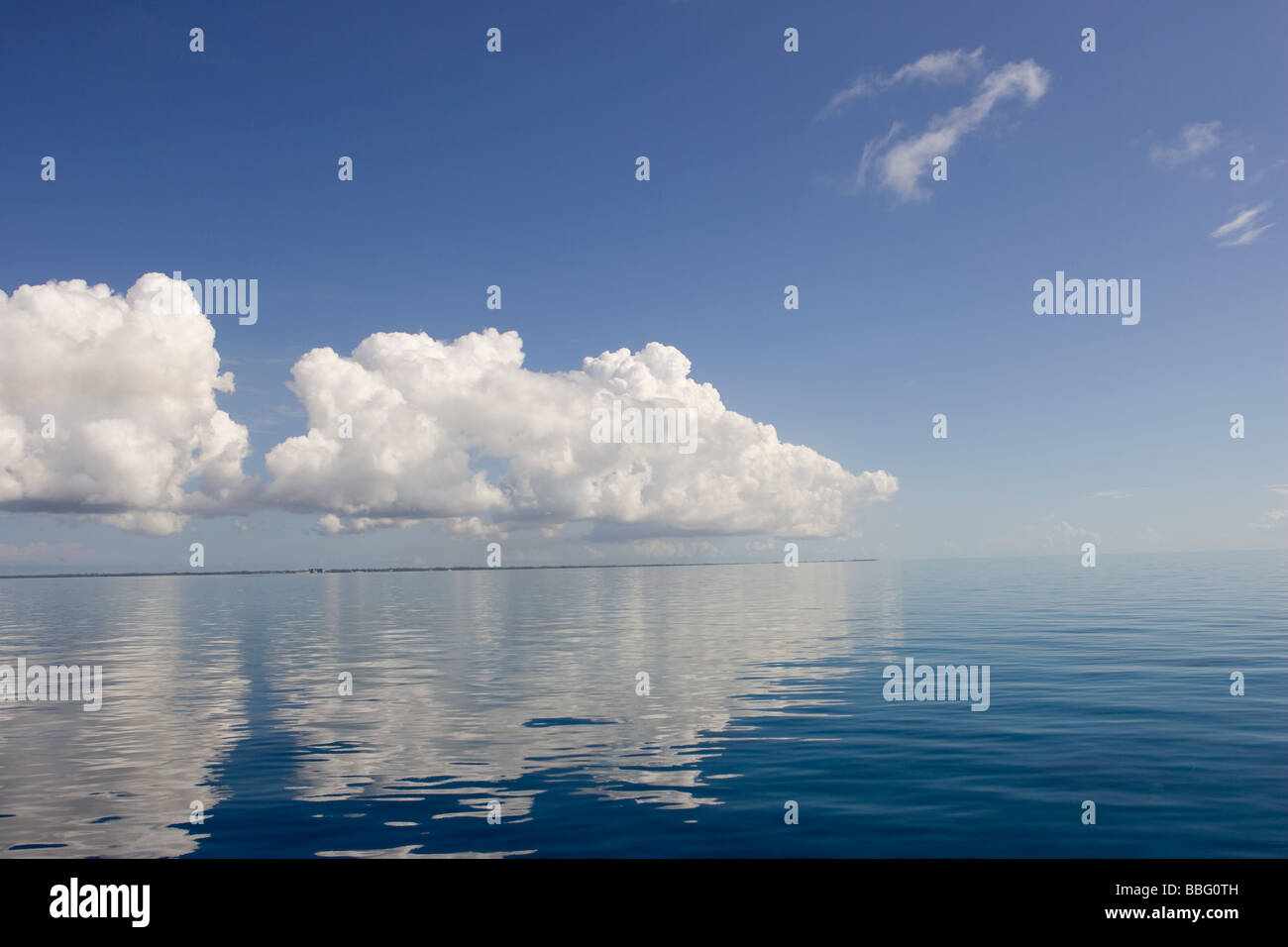 Clouds above calm ocean Stock Photo - Alamy