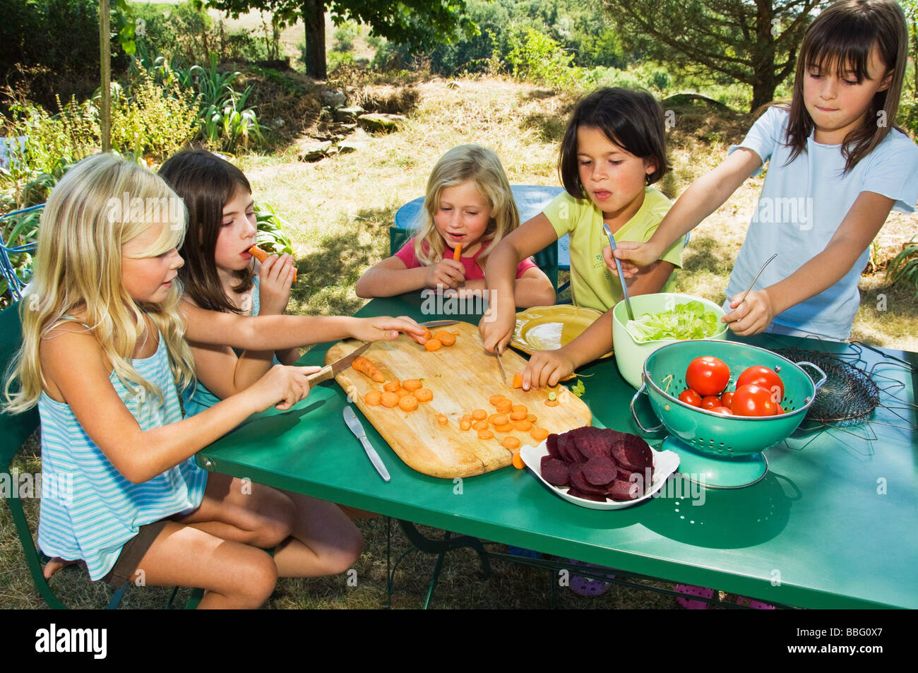 Girls preparing vegetables Stock Photo - Alamy
