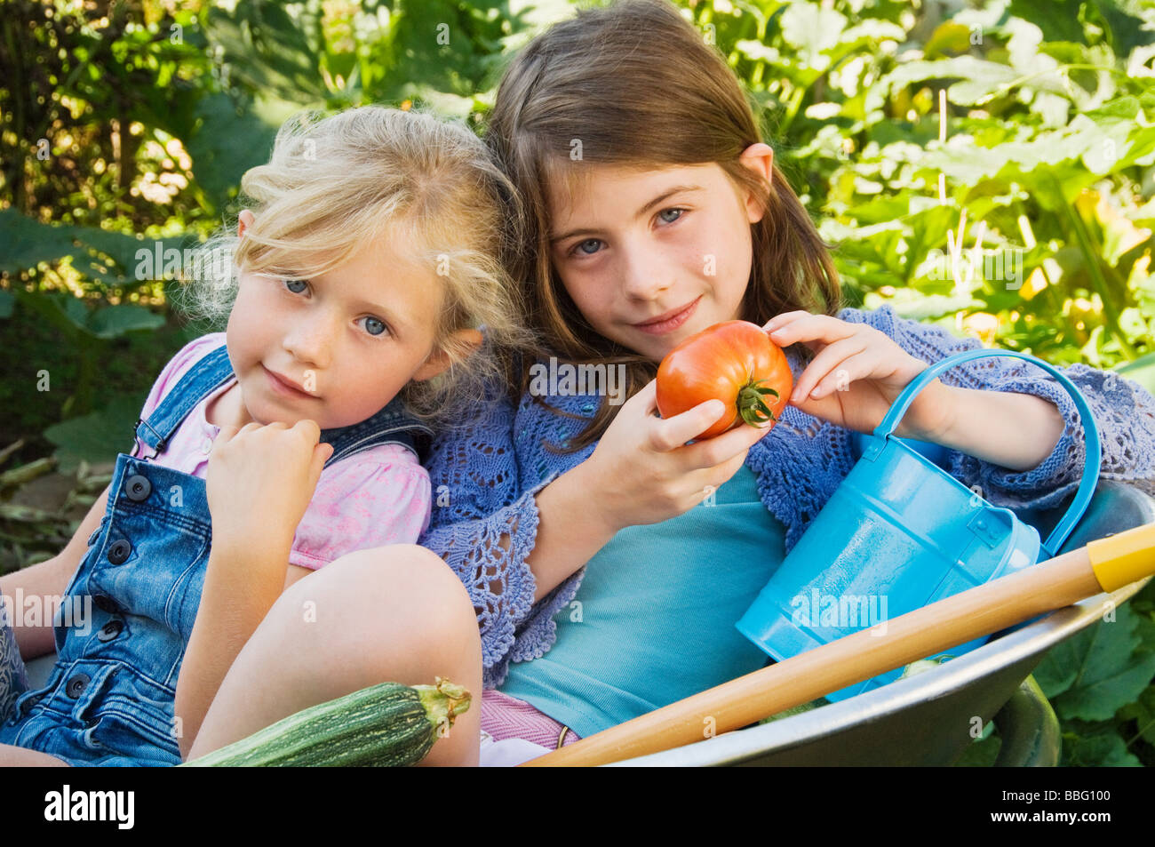 Girls in garden Stock Photo - Alamy