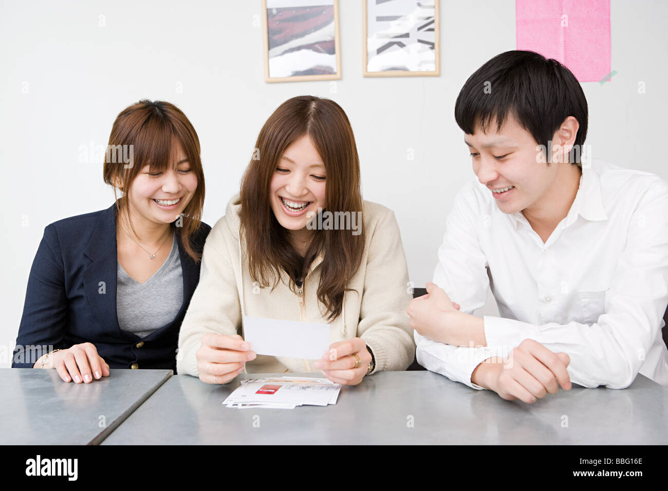 People looking at photographs Stock Photo - Alamy