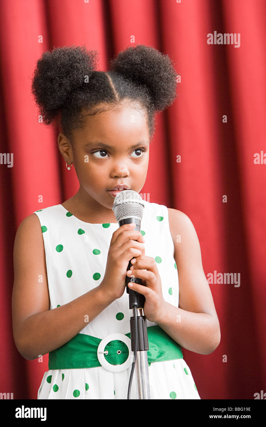 Girl with microphone Stock Photo - Alamy