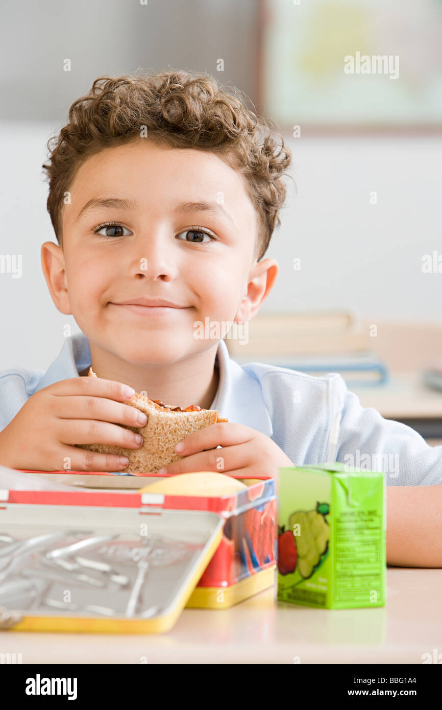 Schoolboy with packed lunch Stock Photo - Alamy