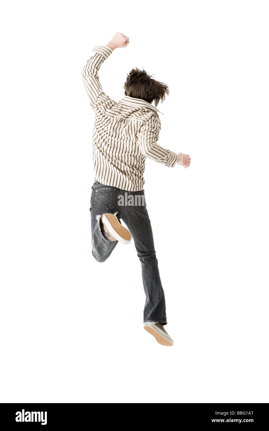 Young man jumping Stock Photo - Alamy