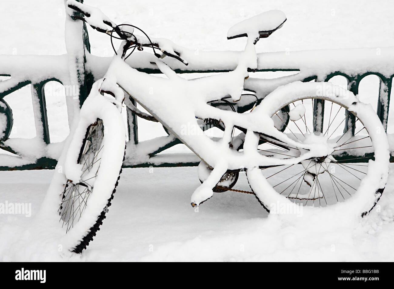 Snow covered bicycle Stock Photo - Alamy