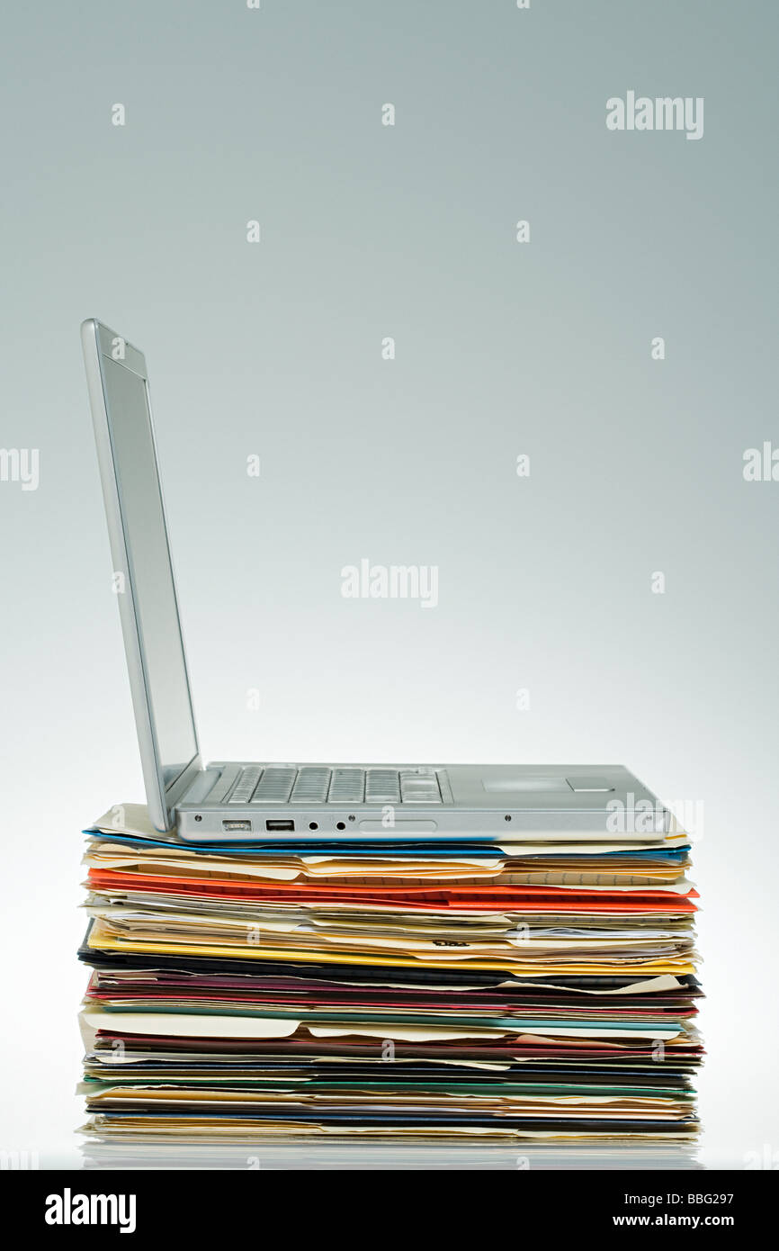 Laptop on files Stock Photo - Alamy