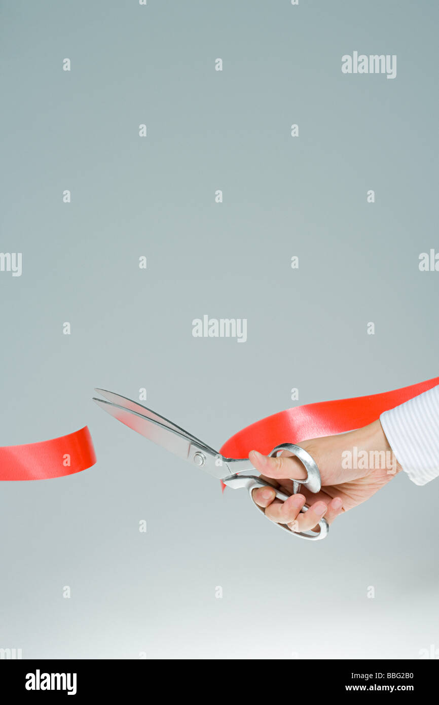 Person cutting ribbon Stock Photo - Alamy