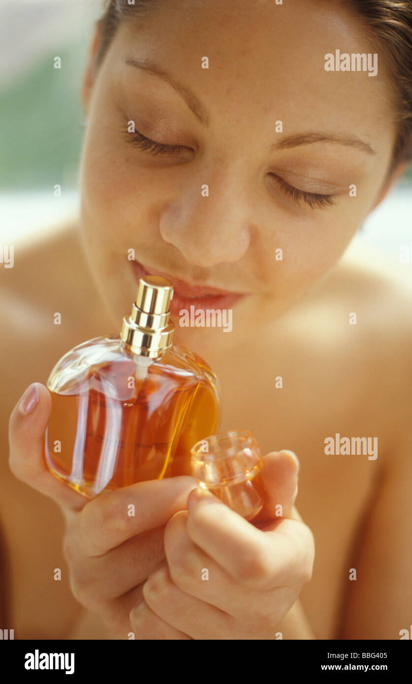close up of a woman sniffing perfume Stock Photo - Alamy