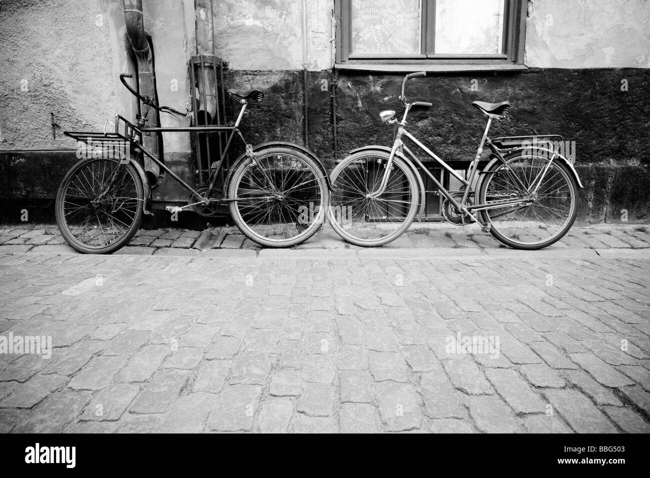 Two bicycles in street Stock Photo - Alamy