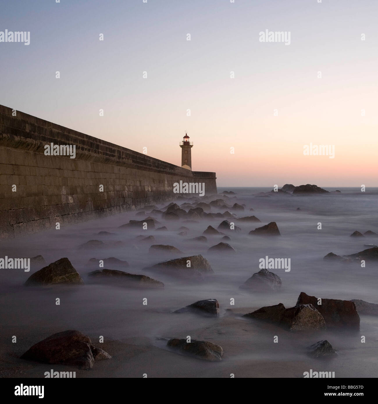 Sunset at lighthouse Stock Photo - Alamy