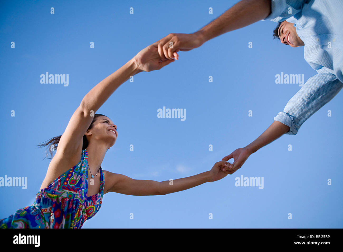 Loving couple hold hands Stock Photo - Alamy