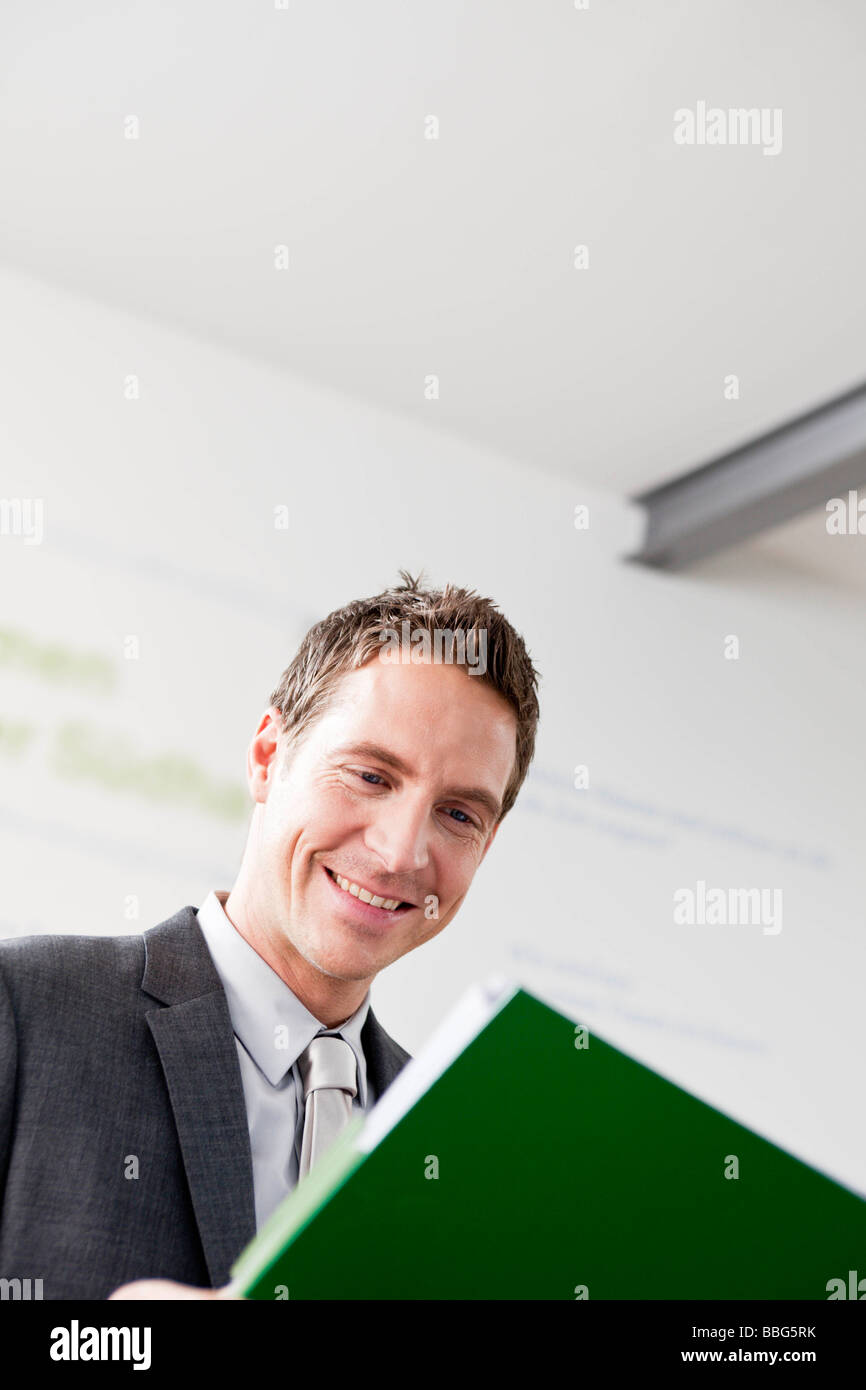 Head and shoulders of man reading papers hi-res stock photography and ...