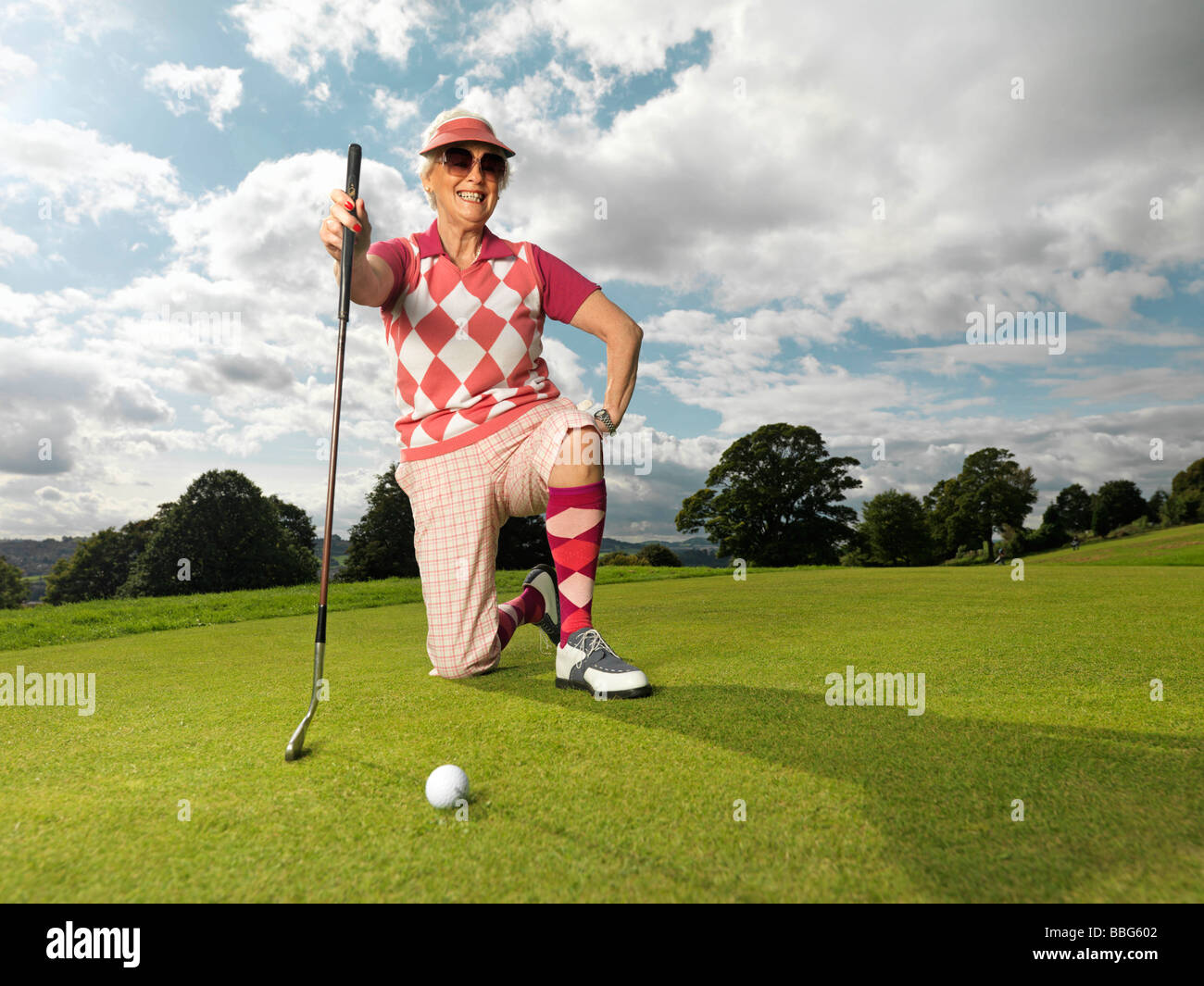 Happy seniors playing golf hi-res stock photography and images - Alamy
