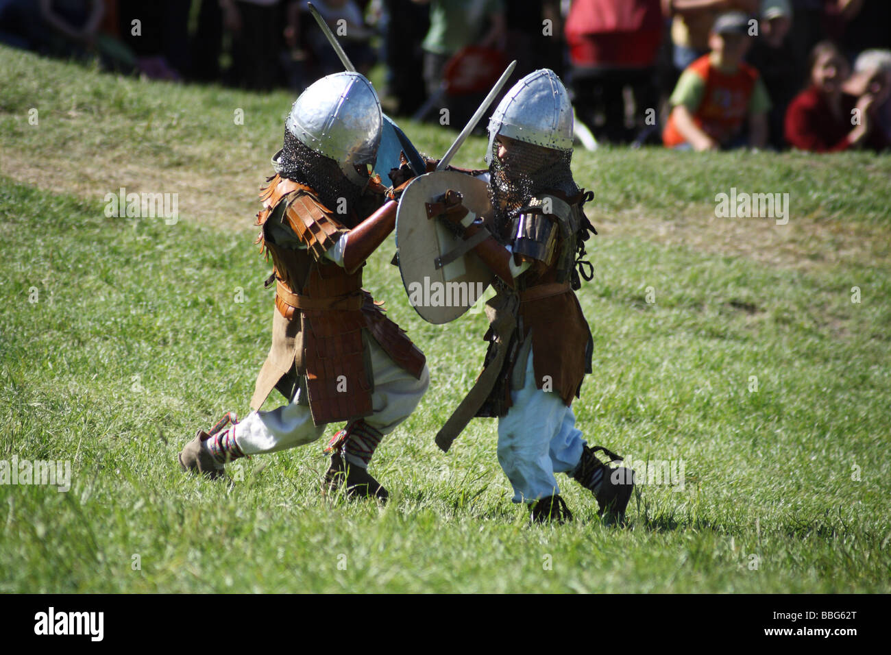 Children play fight with swords during re enactment of a medieval ...