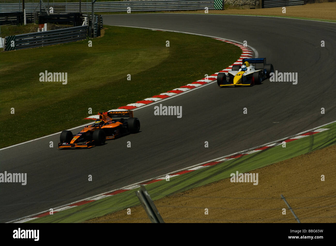 An Arrows Formula 1 Racing Car leading A G Force Indy Racing Car Stock ...
