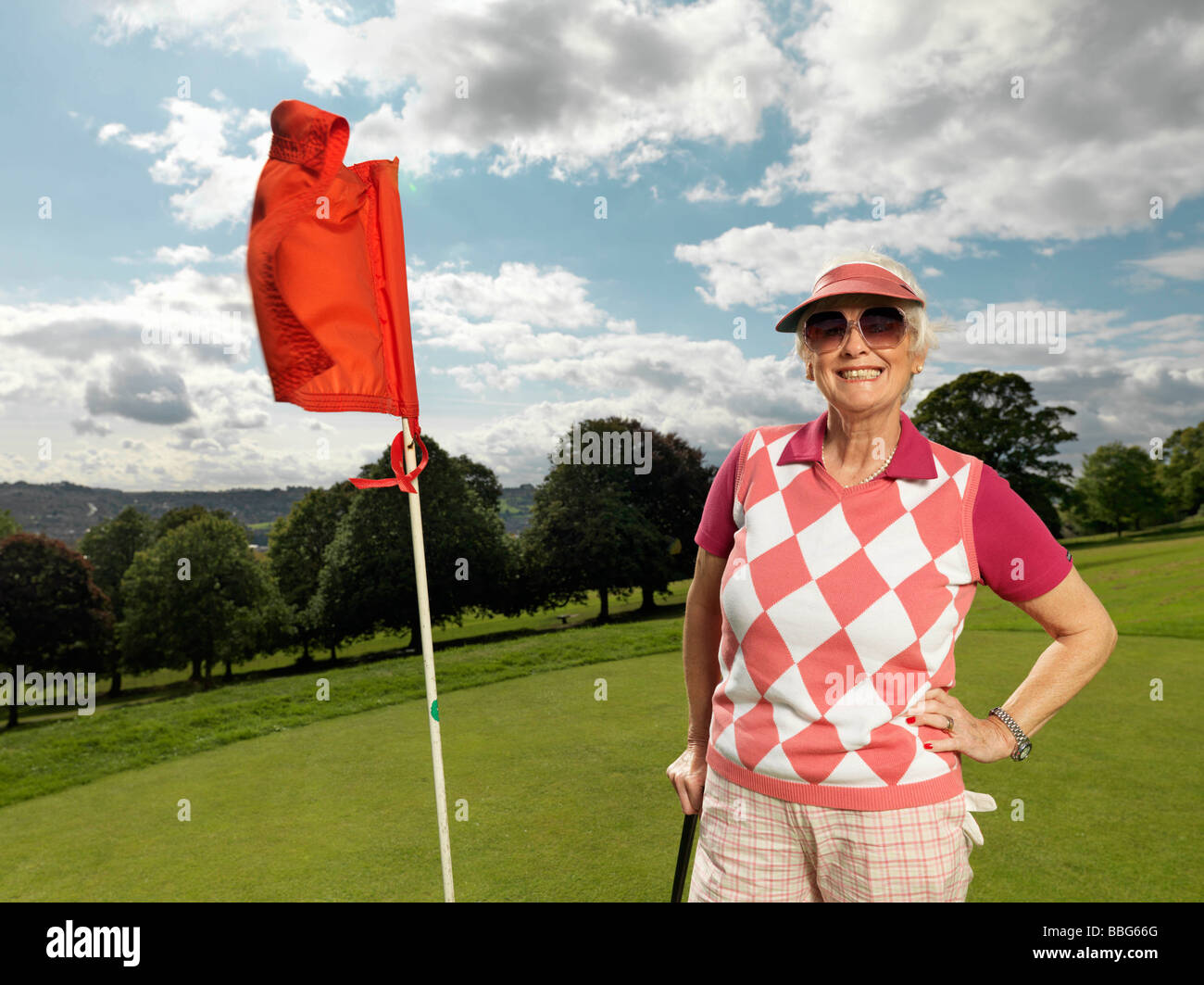 Mature lady playing golf Stock Photo - Alamy