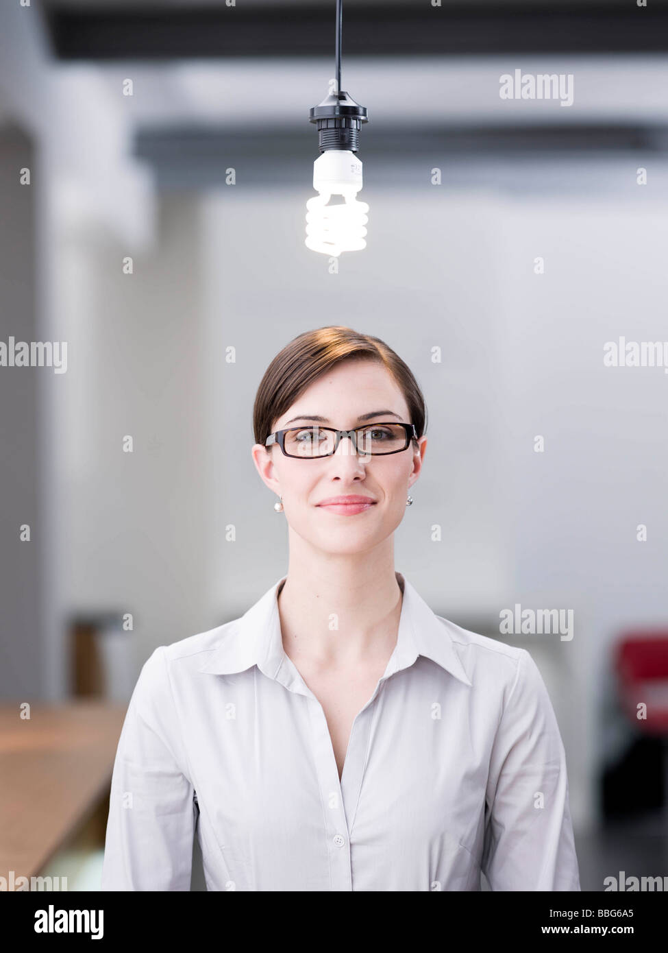 Woman standing under lamp hi-res stock photography and images - Alamy
