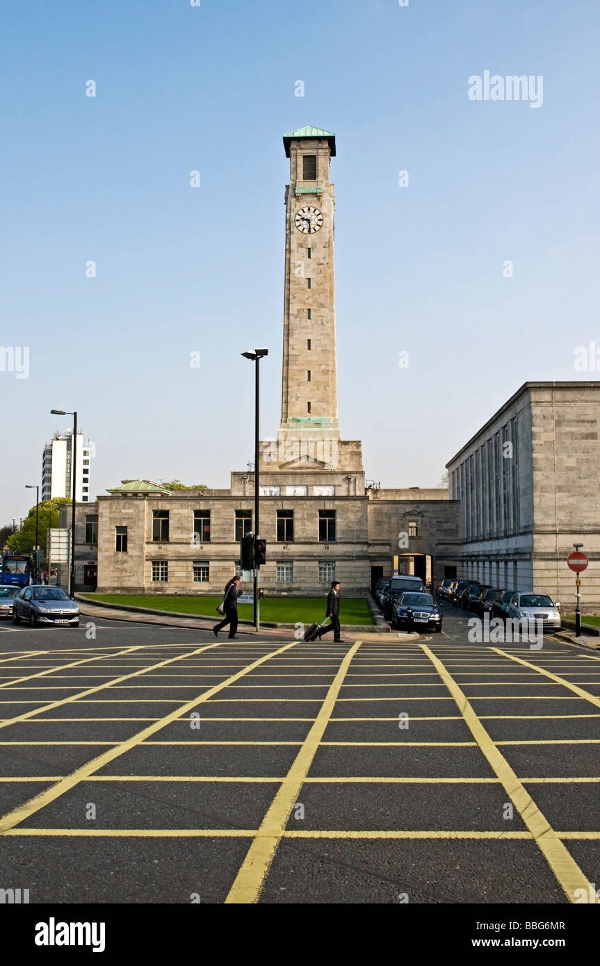 The clock tower displays the time of day well above the office ...