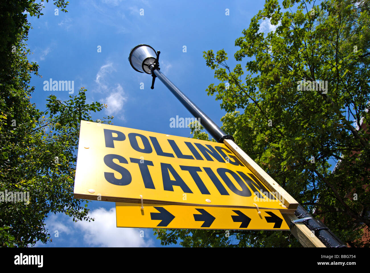 british yellow and black polling station sign with row of right ...