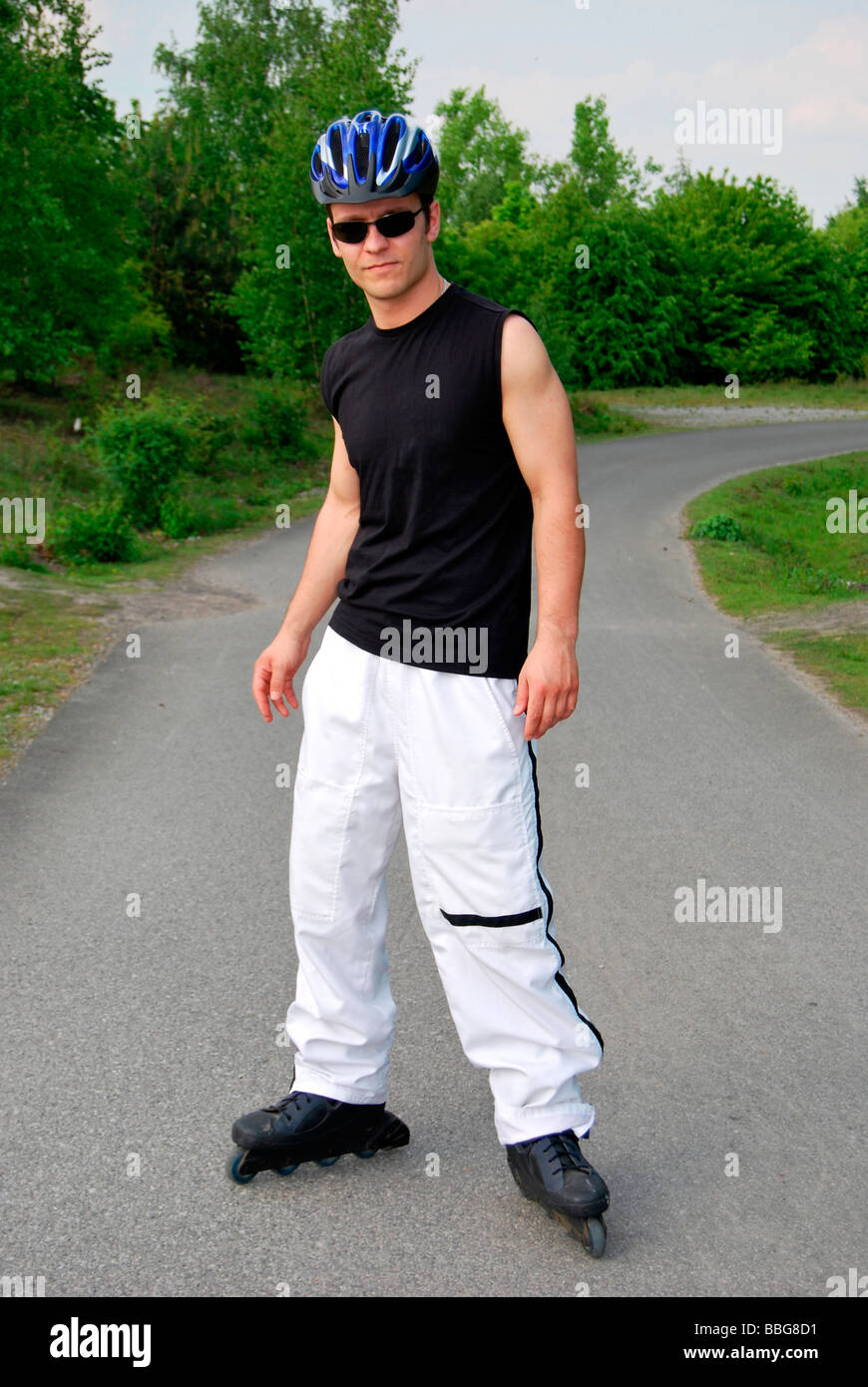 In-line skater wearing helmet and sunglasses Stock Photo - Alamy